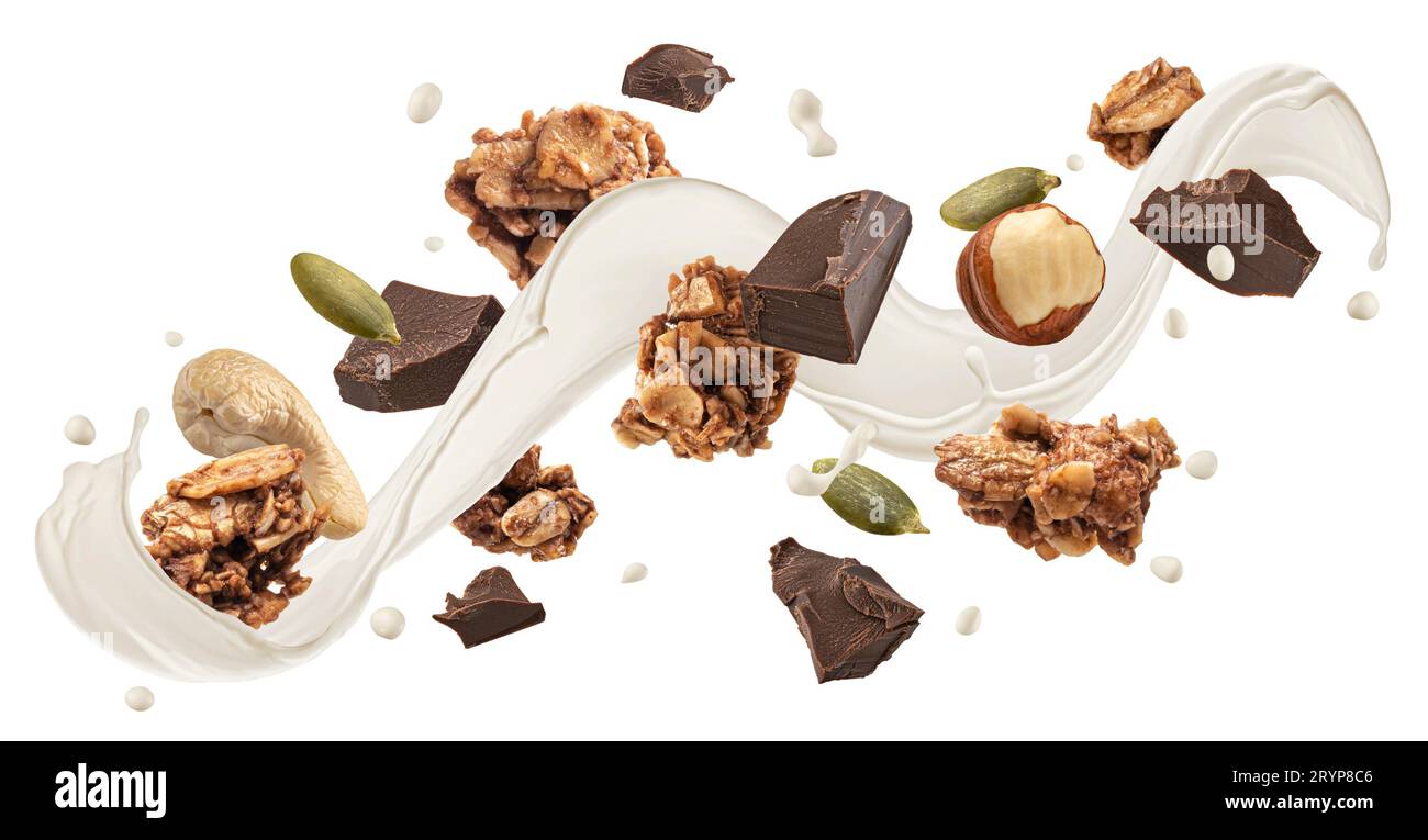 Falling granola with milk splash, nuts and chocolate pieces isolated on ...