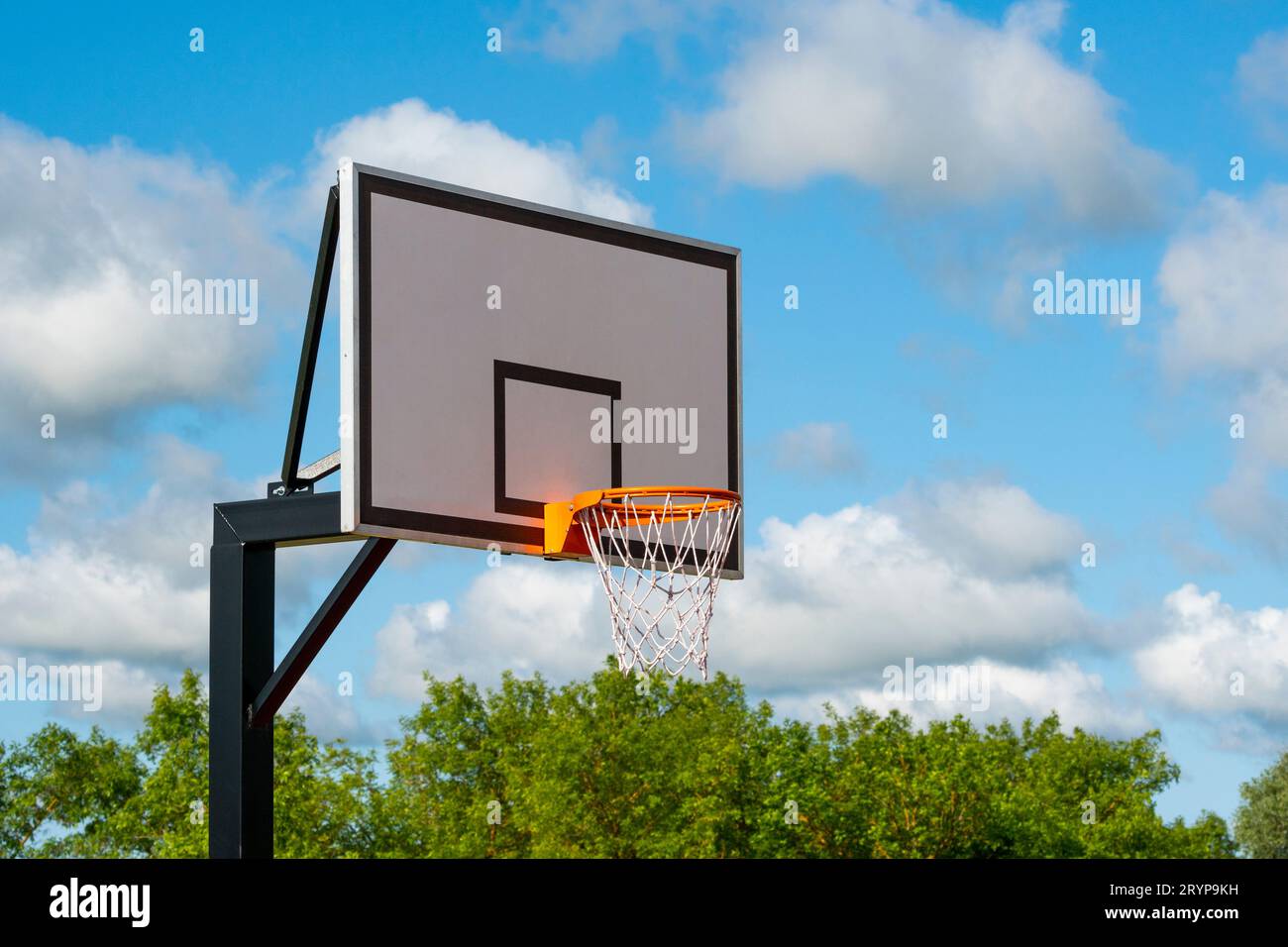 Basketball shield with a ring on outdoor court Stock Photo - Alamy