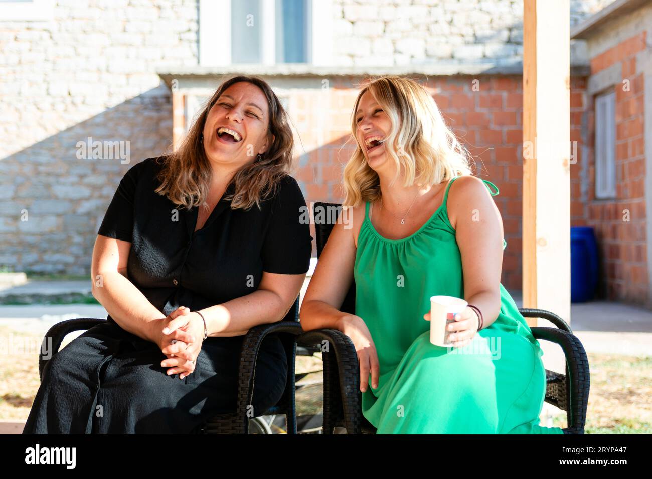 Two women sit on porch hi-res stock photography and images - Alamy