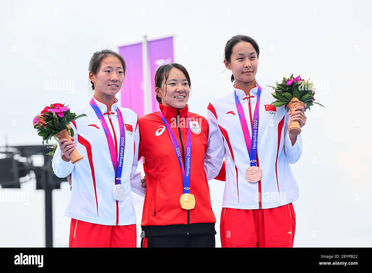 Winner Yuko Takahashi (C) with 2nd place Lin Xinyu(L) and 3rd place ...