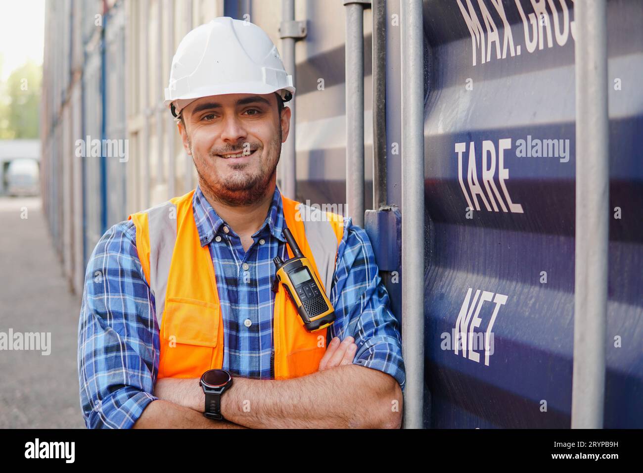 Portrait of smiling container man worker in container warehouse. Import ...