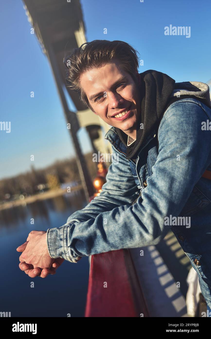 Relaxed looking handsome young hi-res stock photography and images - Alamy