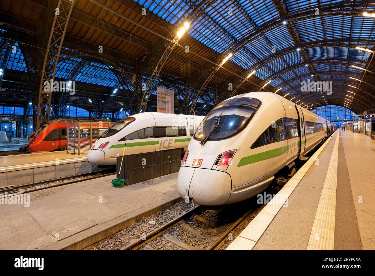 Two ICE trains and a local train in the early morning at the main ...