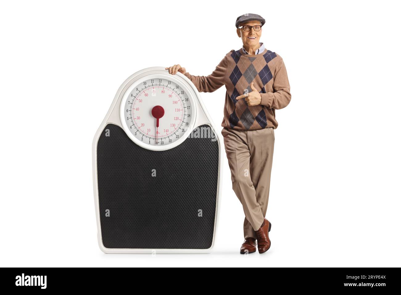 Elderly man pointing at a big weight scale isolated on white background ...