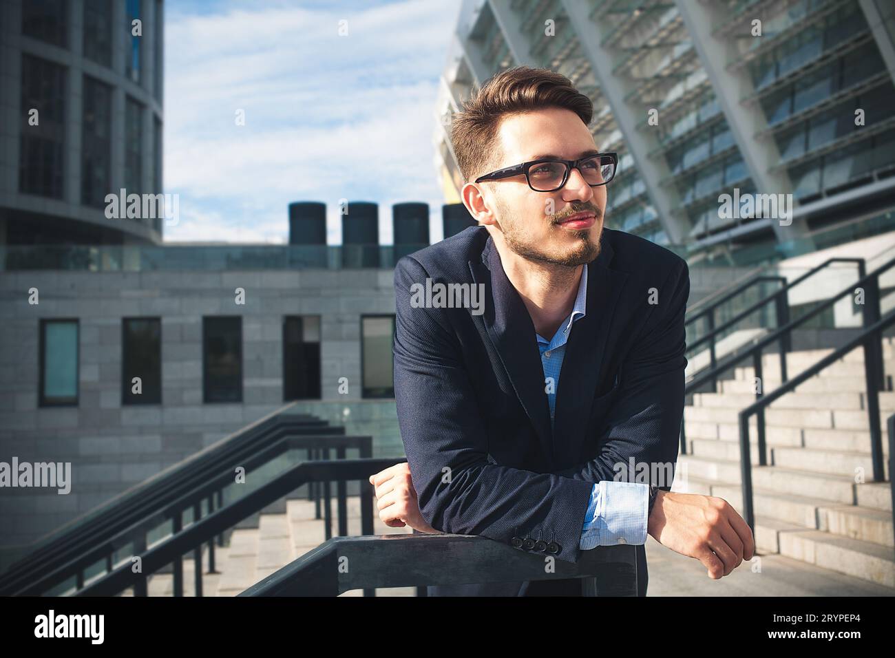 Successful caucasian businessman stand on stairs in modern city Stock ...