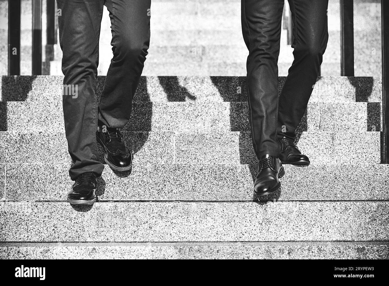 Two people walking up stairs Black and White Stock Photos & Images - Alamy