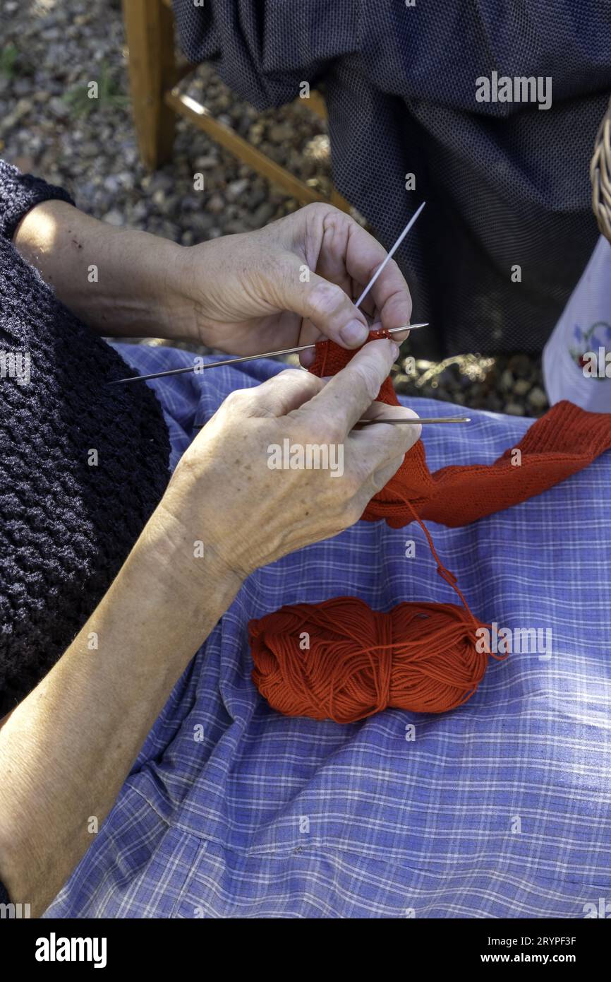 Detail of woman sewing wool by hand, ancient tradition Stock Photo - Alamy