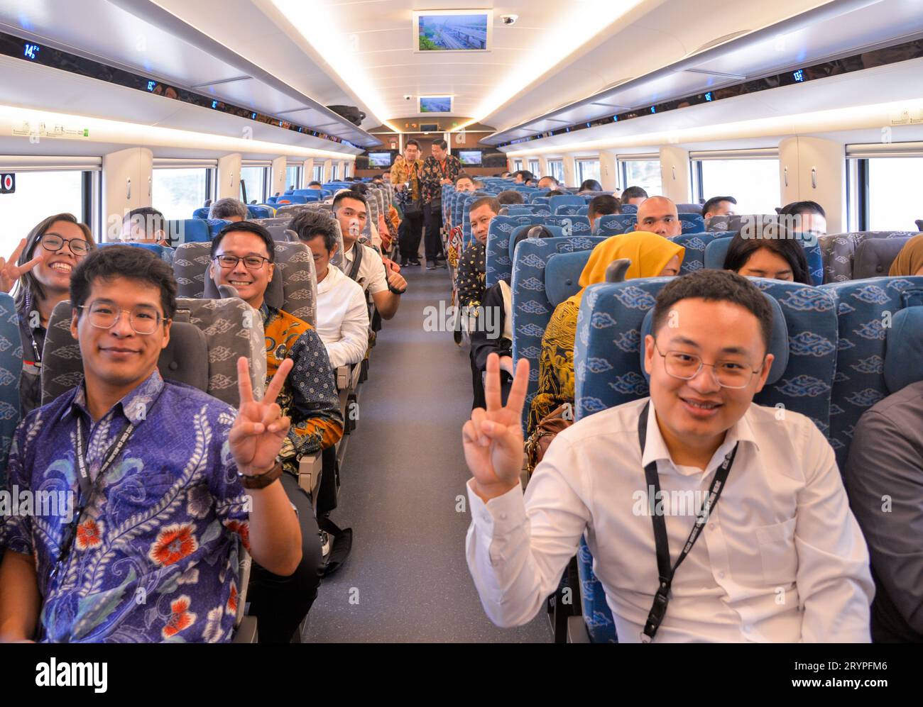 Jakarta. 2nd Oct, 2023. Passengers pose for photos aboard a high-speed ...
