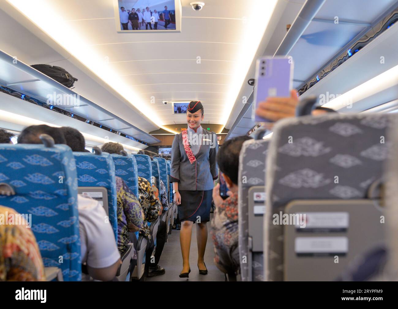 Jakarta. 2nd Oct, 2023. A train attendant walks in a high-speed ...