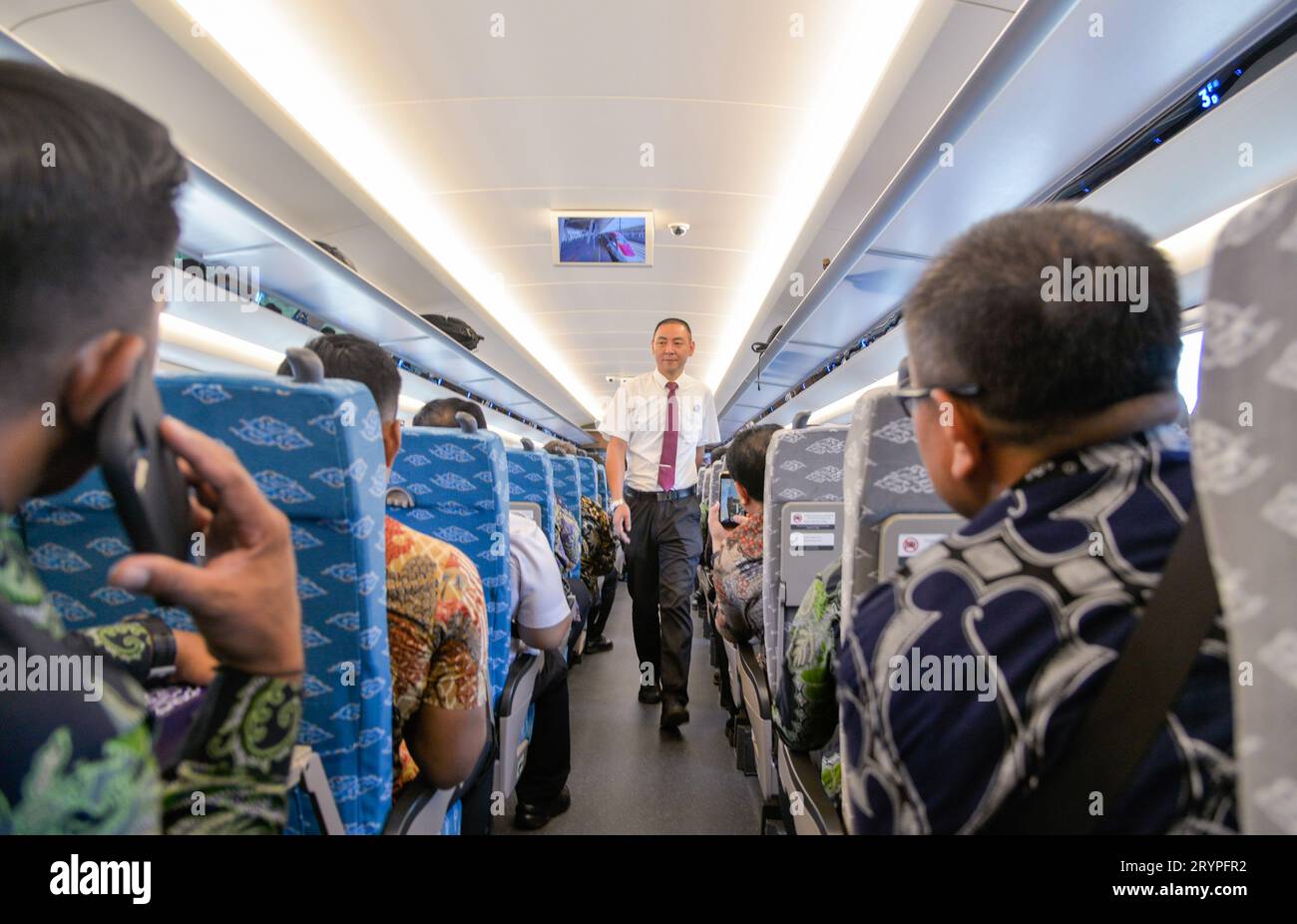 Jakarta. 2nd Oct, 2023. A train crew member walks in a high-speed ...