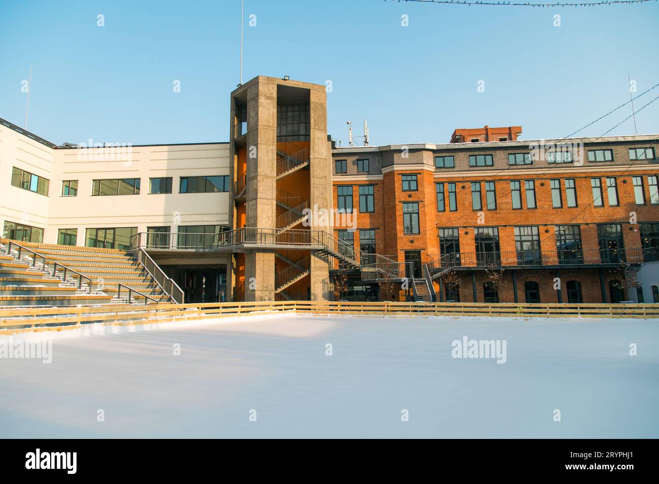 Facade of red brick building with outdoor iron stairs. Industrial ...