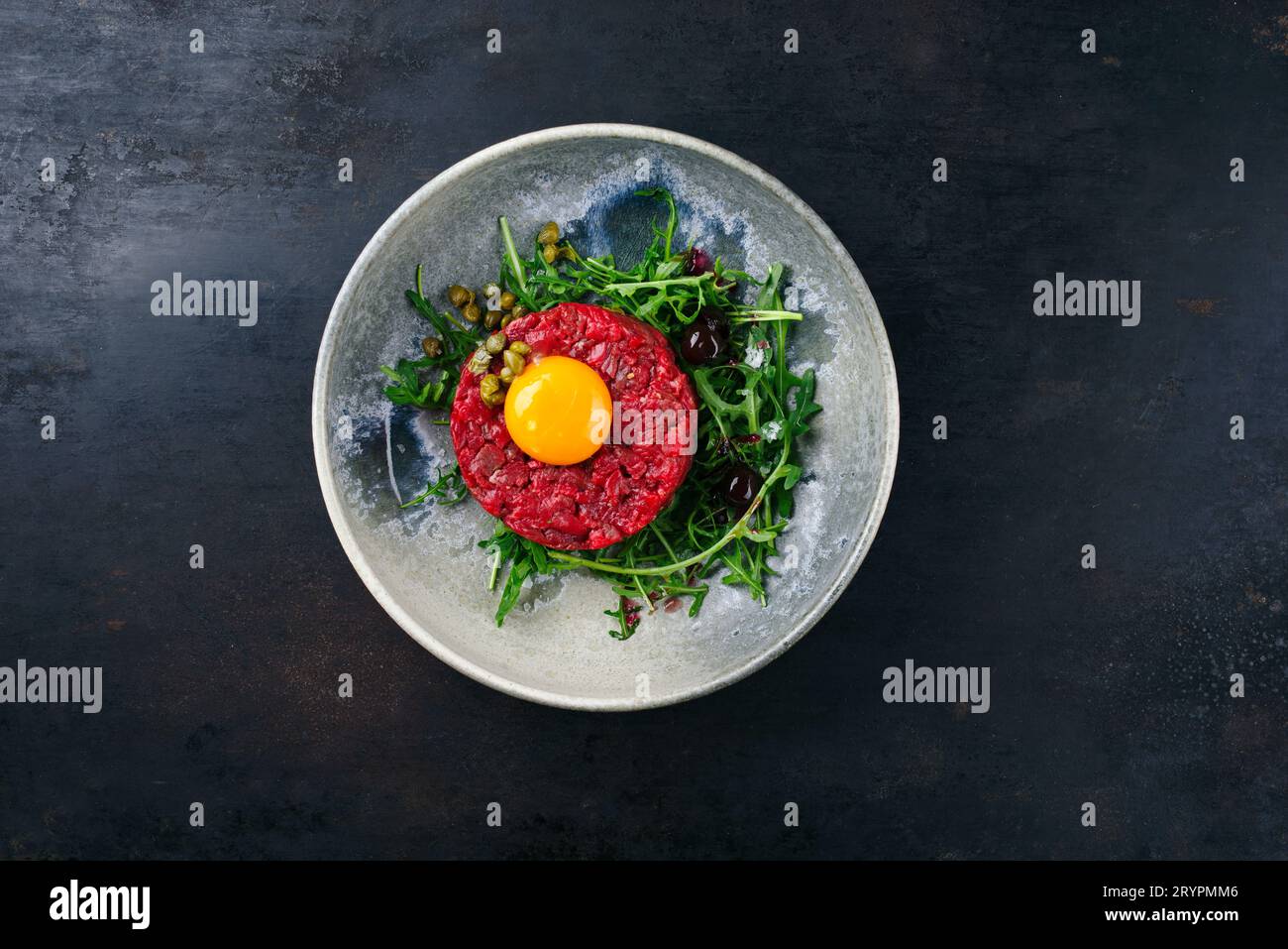 Modern style gourmet tartar raw from beef filet with egg Stock Photo ...