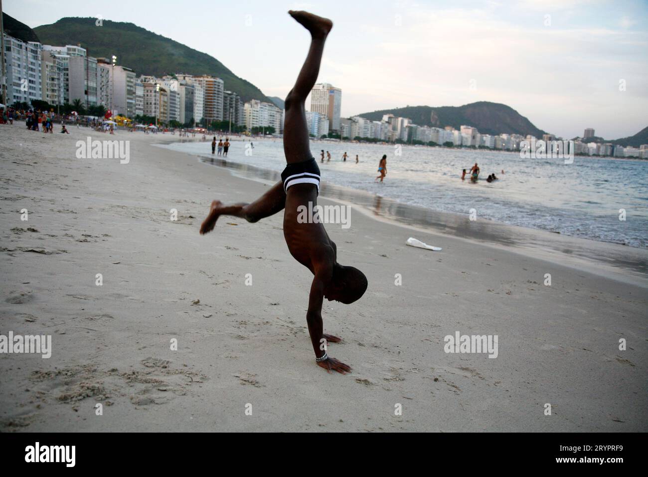 Kid doing acrobatics on Copacabana beach, Rio de Janeiro, Brazil Stock ...