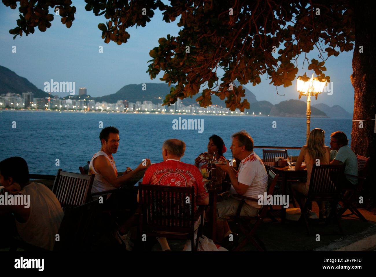 People sitting at Colombo Cafe at the Copacabana fort, Rio de Janeiro ...
