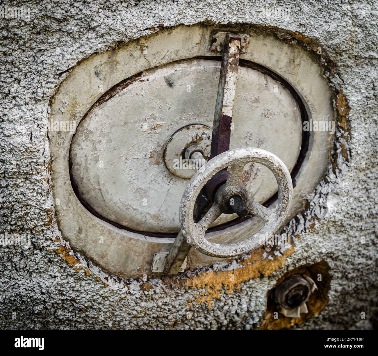 Old rusty hatch valve on a gray tank Stock Photo - Alamy