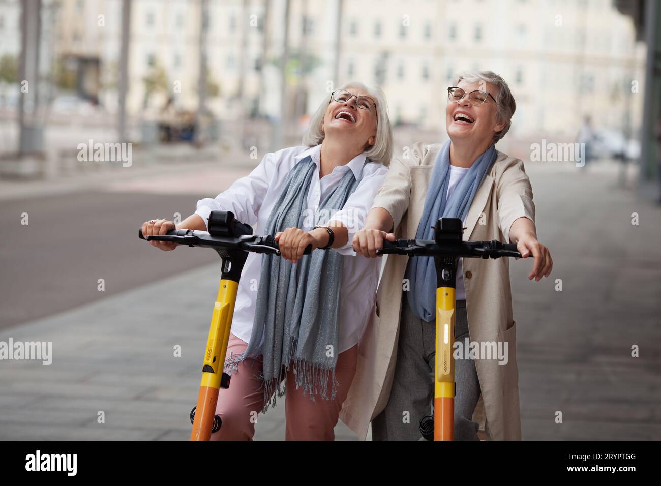 Portrait happy laughing Senior women with gray hair enjoying ride ...