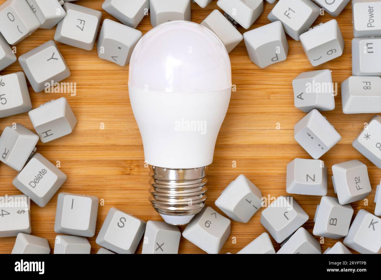 LED light bulb among computer keyboard keys Stock Photo - Alamy