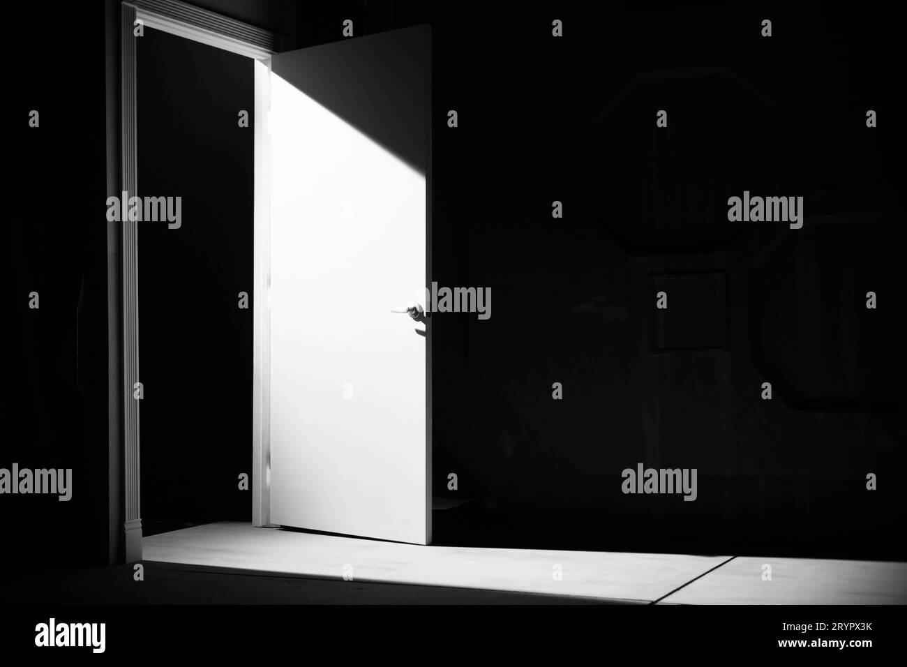 Dark empty room and open door Stock Photo - Alamy