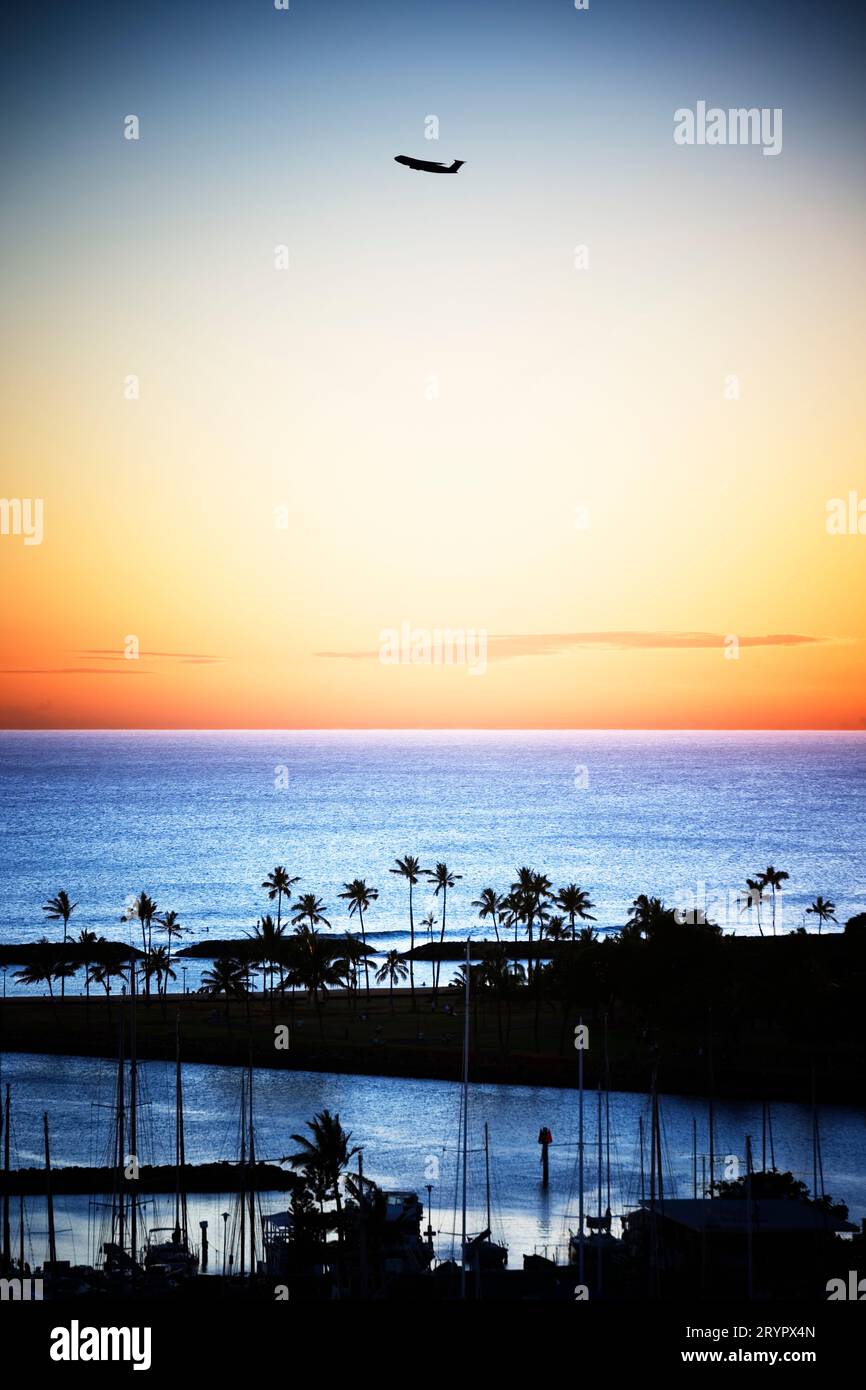 Elevated view of the sunset over the Ala Moana Beach Park with a ...