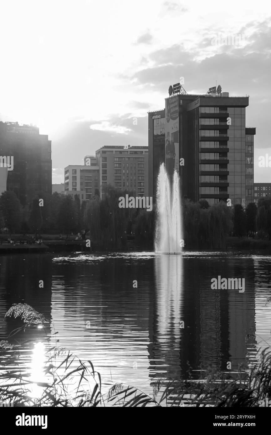 Water fountain in the center of lake at Iulius Park behind Iulius Mall ...