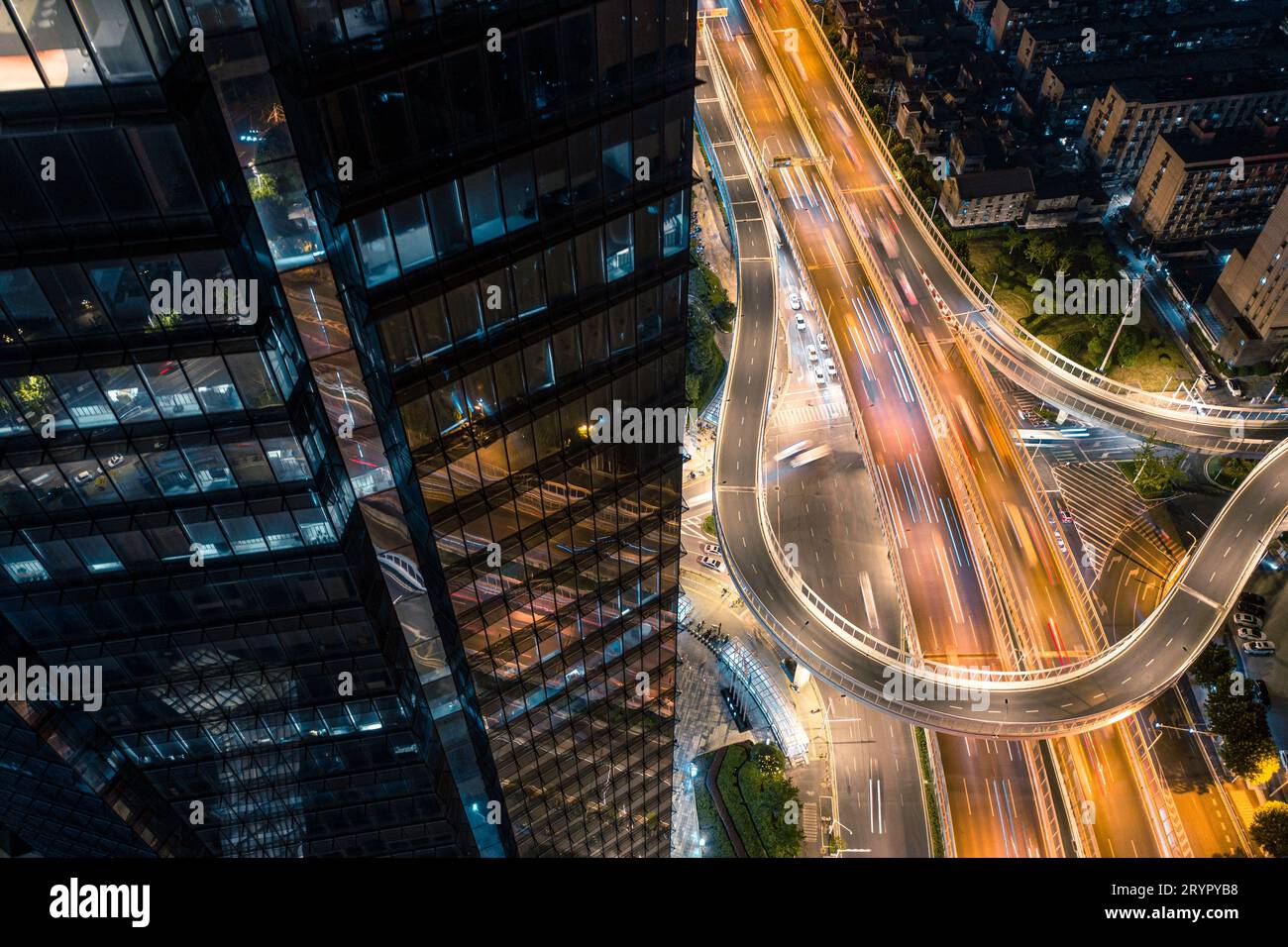 Aerial view of the vibrant nightlife of Tokyo, with cars driving ...