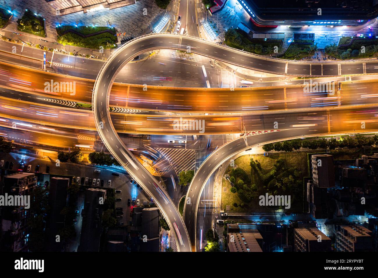 Aerial view of a bustling intersection at night, full of cars moving in ...