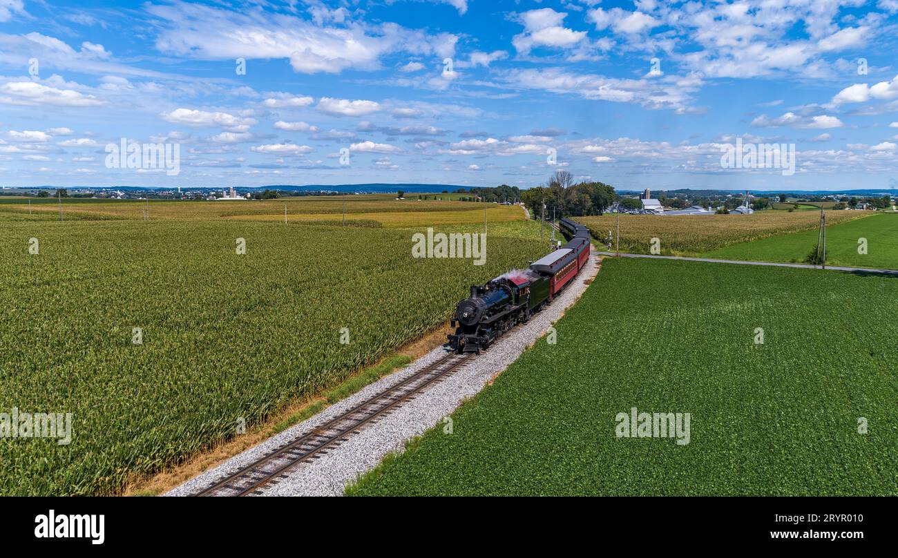 A Drone Frontal View of a Restored Steam Passenger Train, Traveling ...