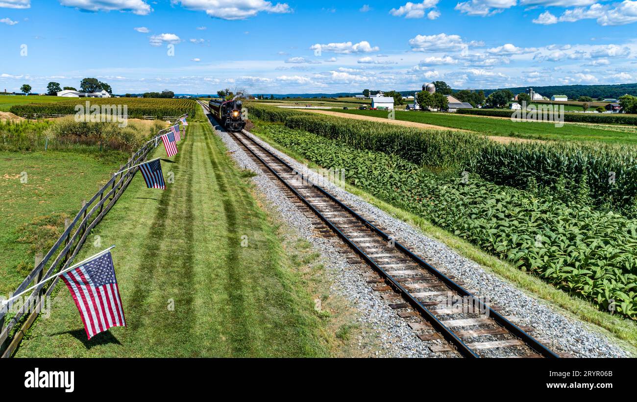 An Aerial View of a Steam Passenger Train Approaching, on a single ...