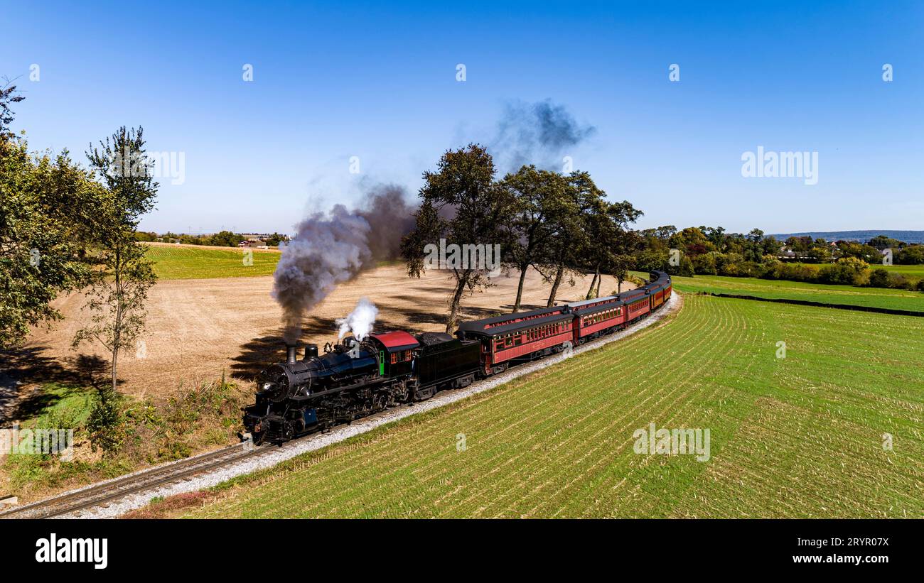 A Drone View of an Antique Steam Passenger Train, Rounding a Curve ...