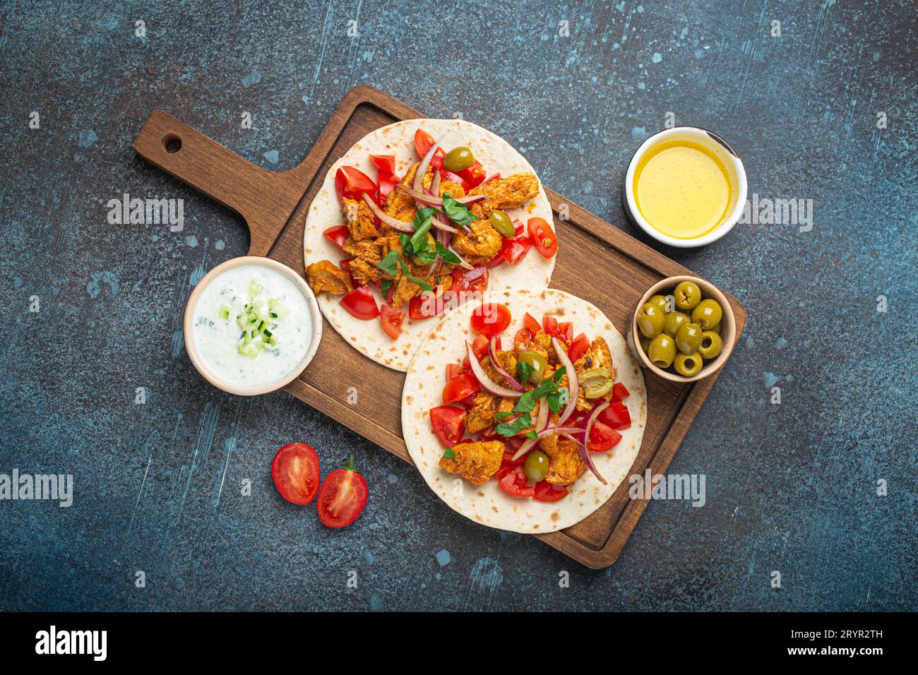 Cooking Traditional Greek Dish Gyros: Pita bread with vegetables, meat ...