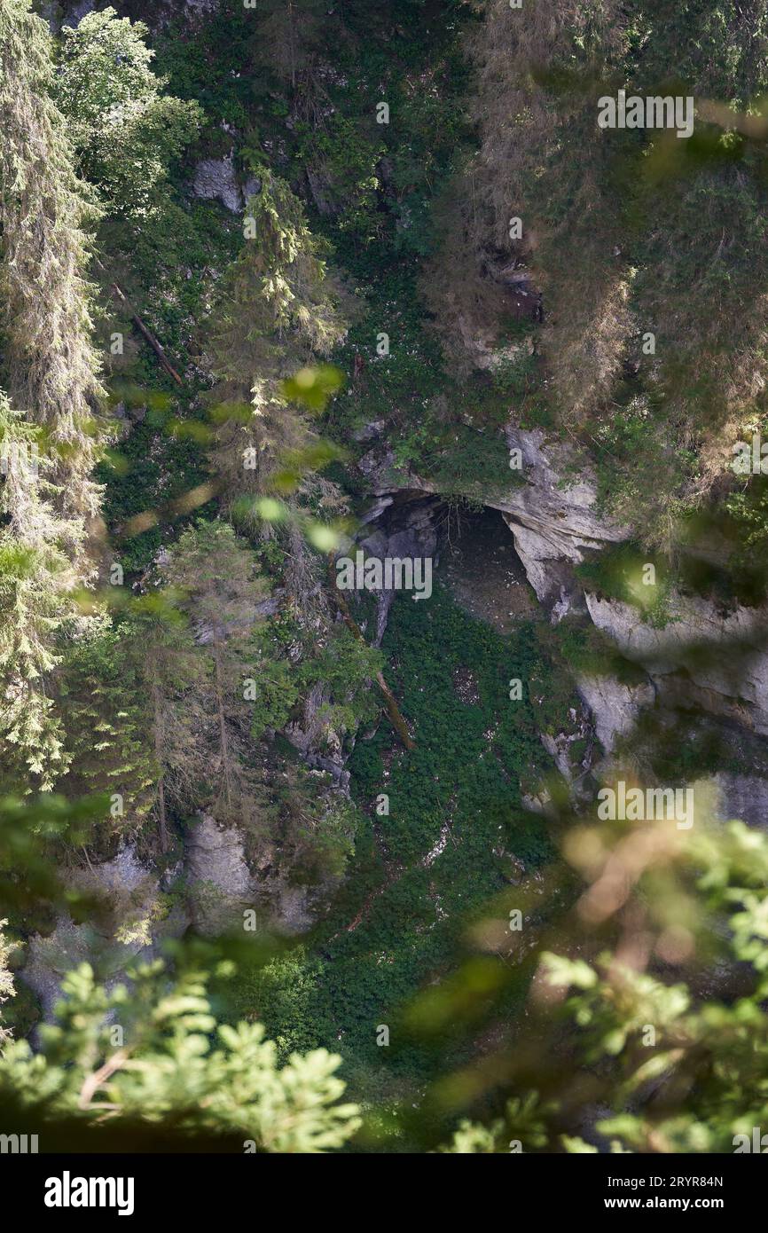Entrance of a cave dug in a limestone mountain, part of a karst complex ...