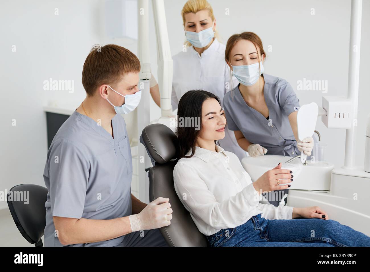 Female patient checking whitening results hi-res stock photography and images - Alamy