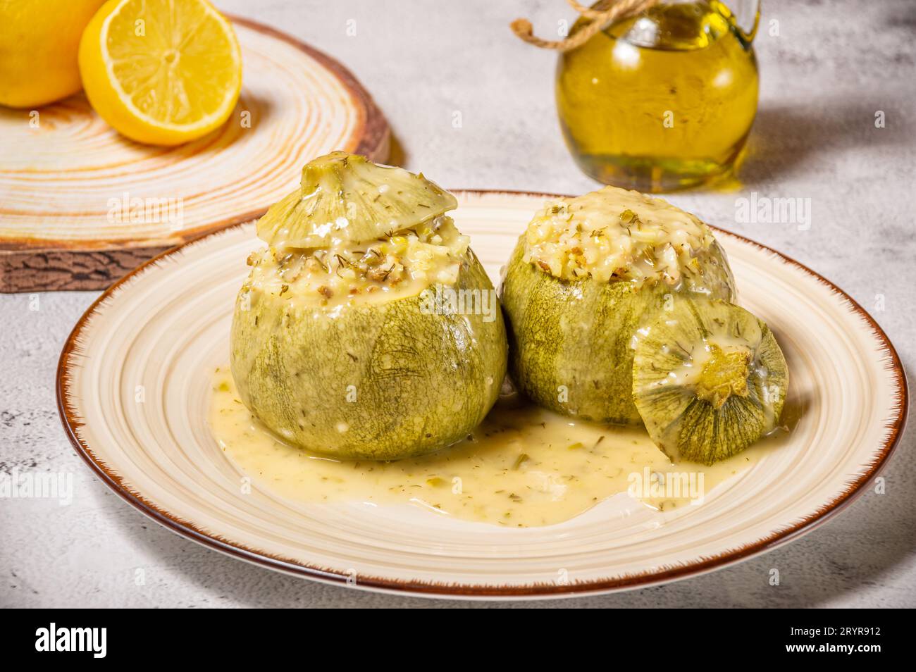 Homemade stuffed zucchini with minced meat , rice and lemon sauce Stock ...