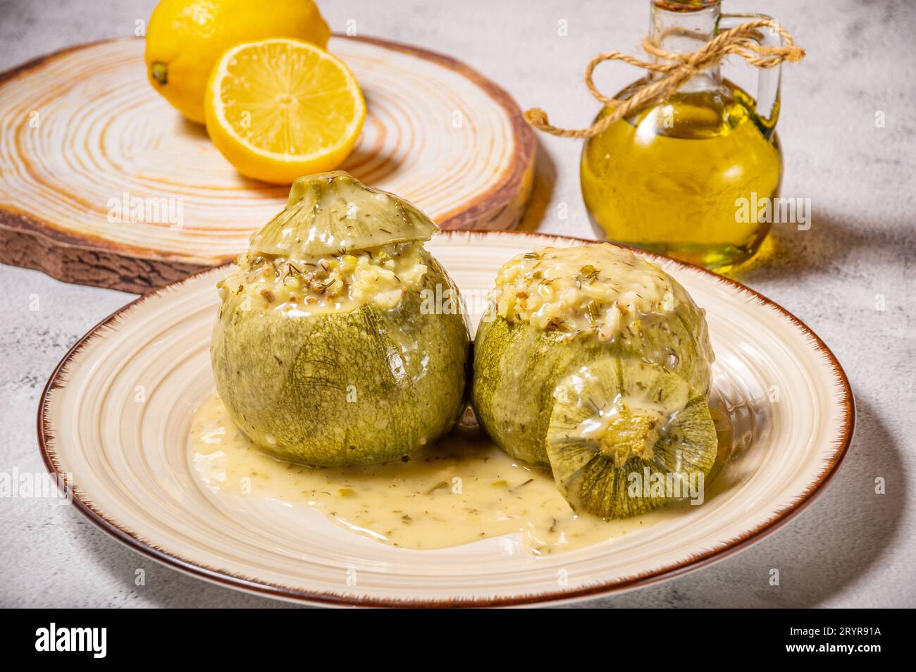Homemade stuffed zucchini with minced meat , rice and lemon sauce Stock ...