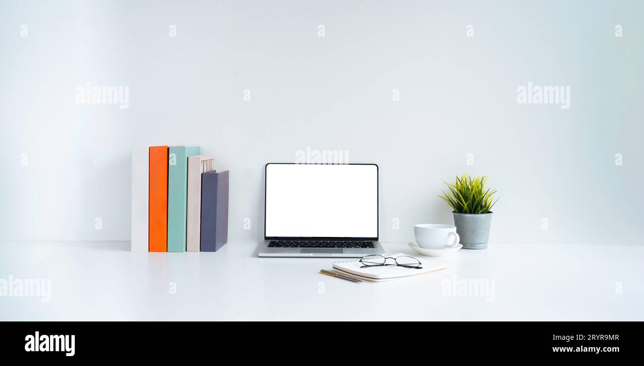 Laptop computer mockup blank white screen on table in white background ...