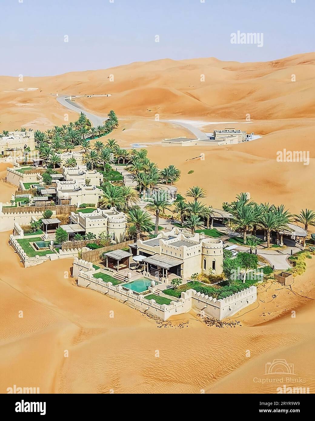 A serene desert landscape featuring a collection of traditional ...
