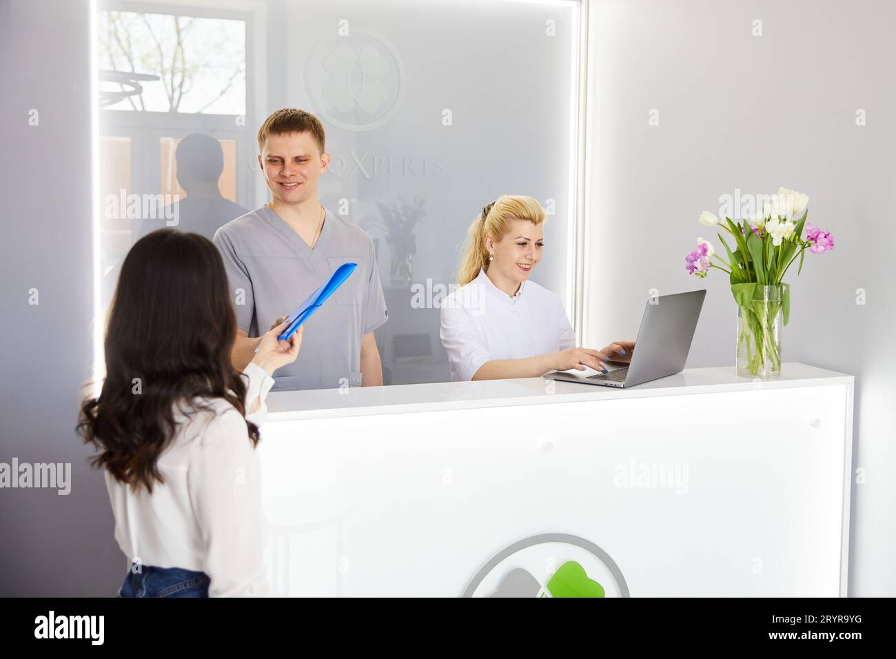 A young pretty girl came to the clinic and talked to doctors at the ...