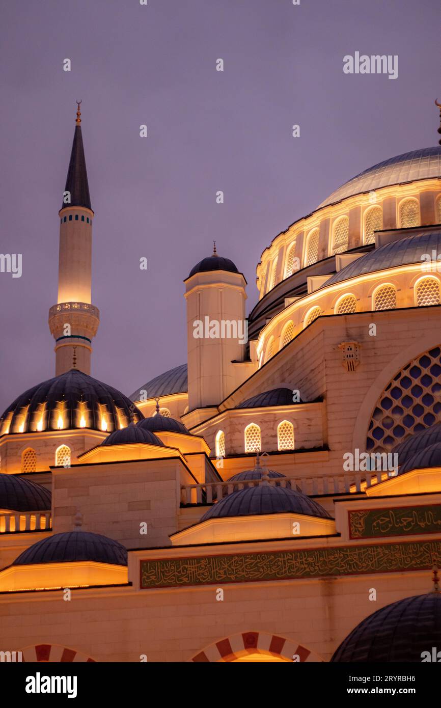 A stunning architectural structure with large illuminated domes atop ...