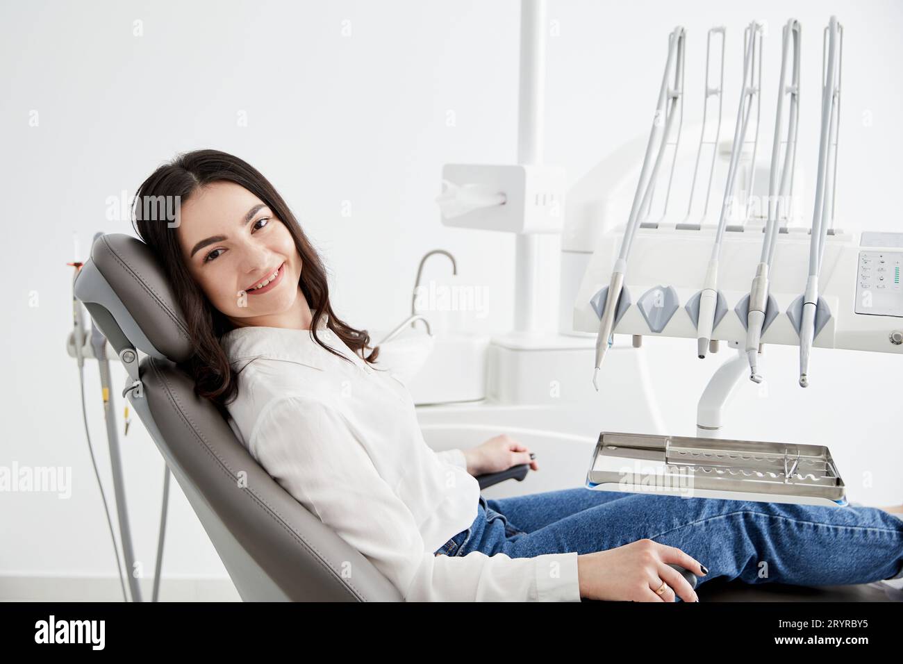 Image Of Satisfied Young Woman Sitting In Dental Chair At Medical