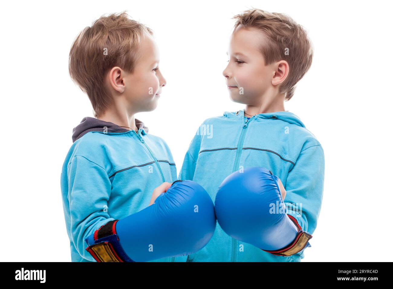 Cute twin boys posing looking at each other Stock Photo - Alamy