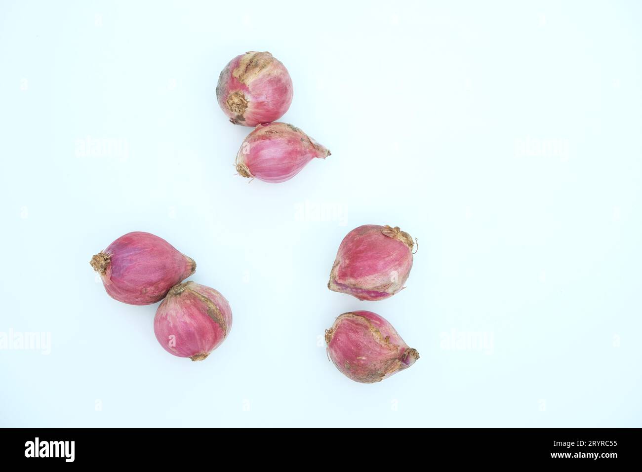 Red tiny onions isolated on white background Stock Photo - Alamy