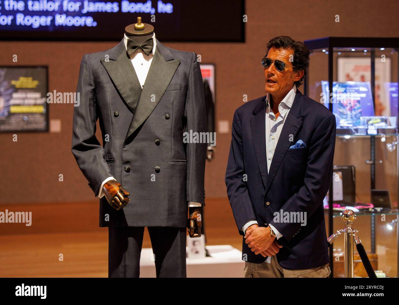 London, UK 2 Oct 2023 Roger MooreÕs son, Geoffrey, stands by a Double ...