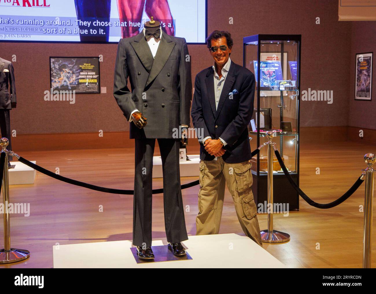 London, UK 2 Oct 2023 Roger MooreÕs son, Geoffrey, stands by a Double ...