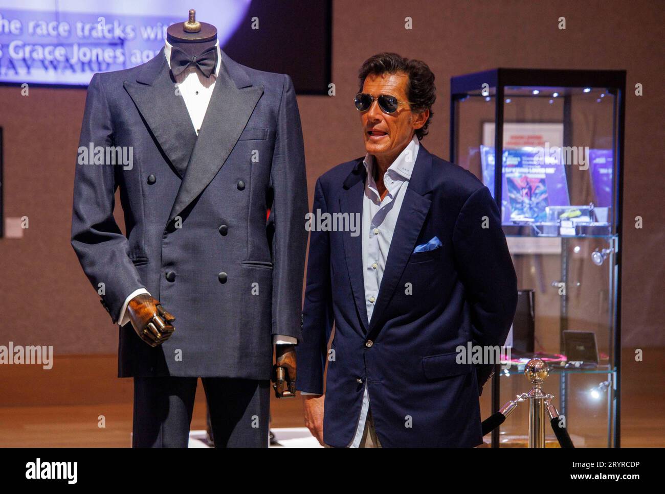 London, UK 2 Oct 2023 Roger MooreÕs son, Geoffrey, stands by a Double ...