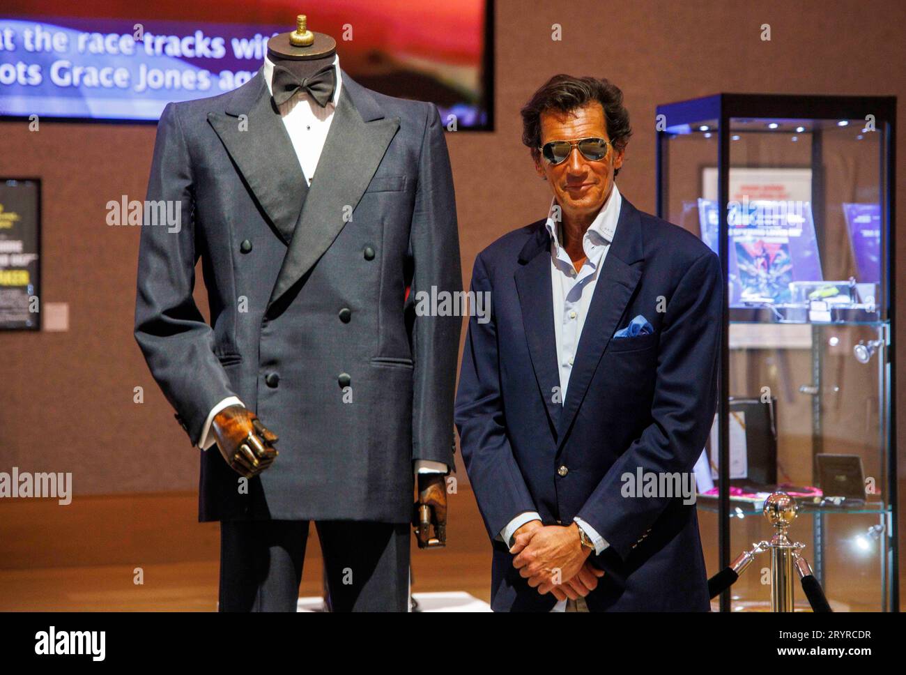 London, UK 2 Oct 2023 Roger MooreÕs son, Geoffrey, stands by a Double ...