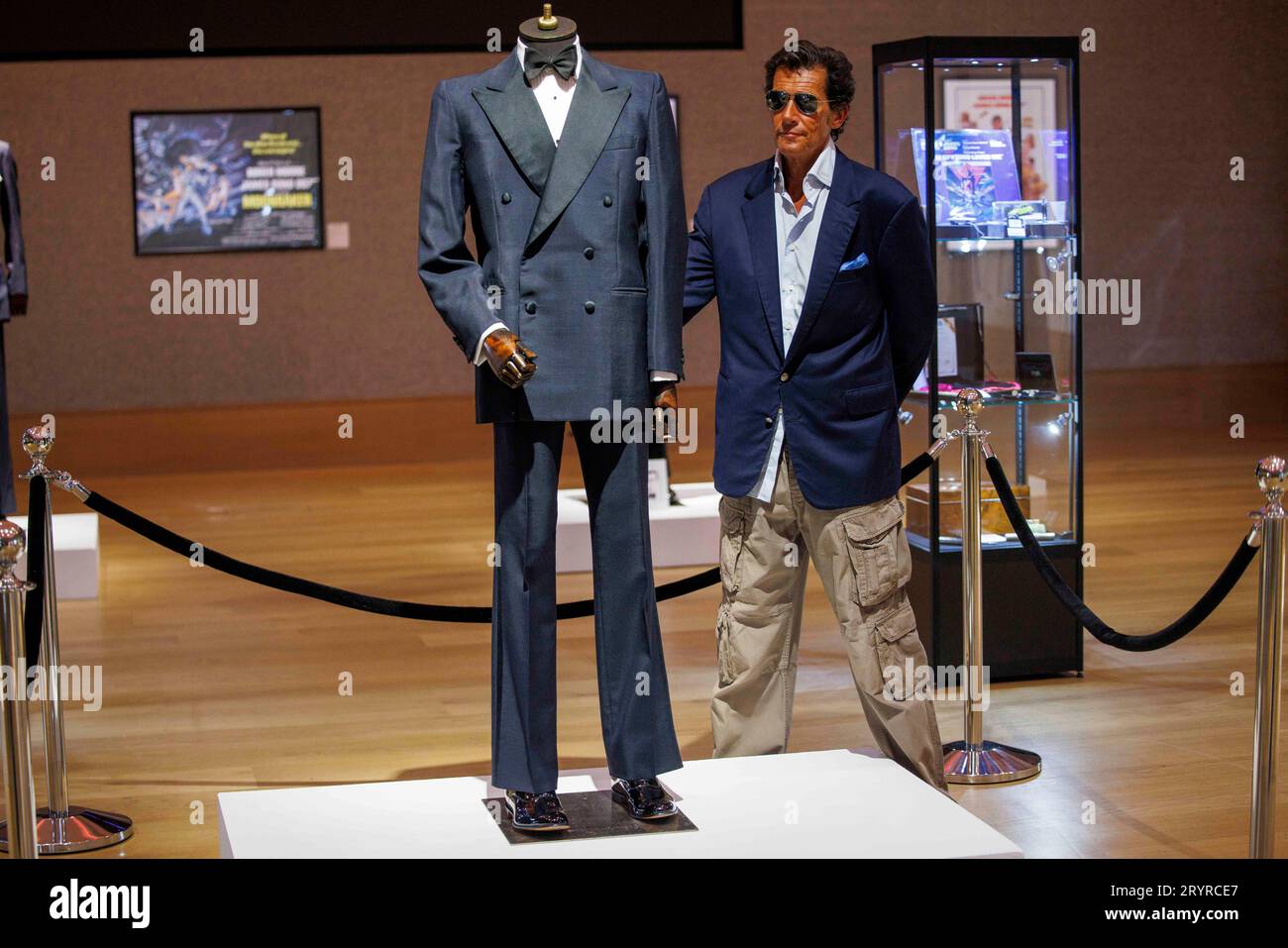 London, UK 2 Oct 2023 Roger MooreÕs son, Geoffrey, stands by a Double ...