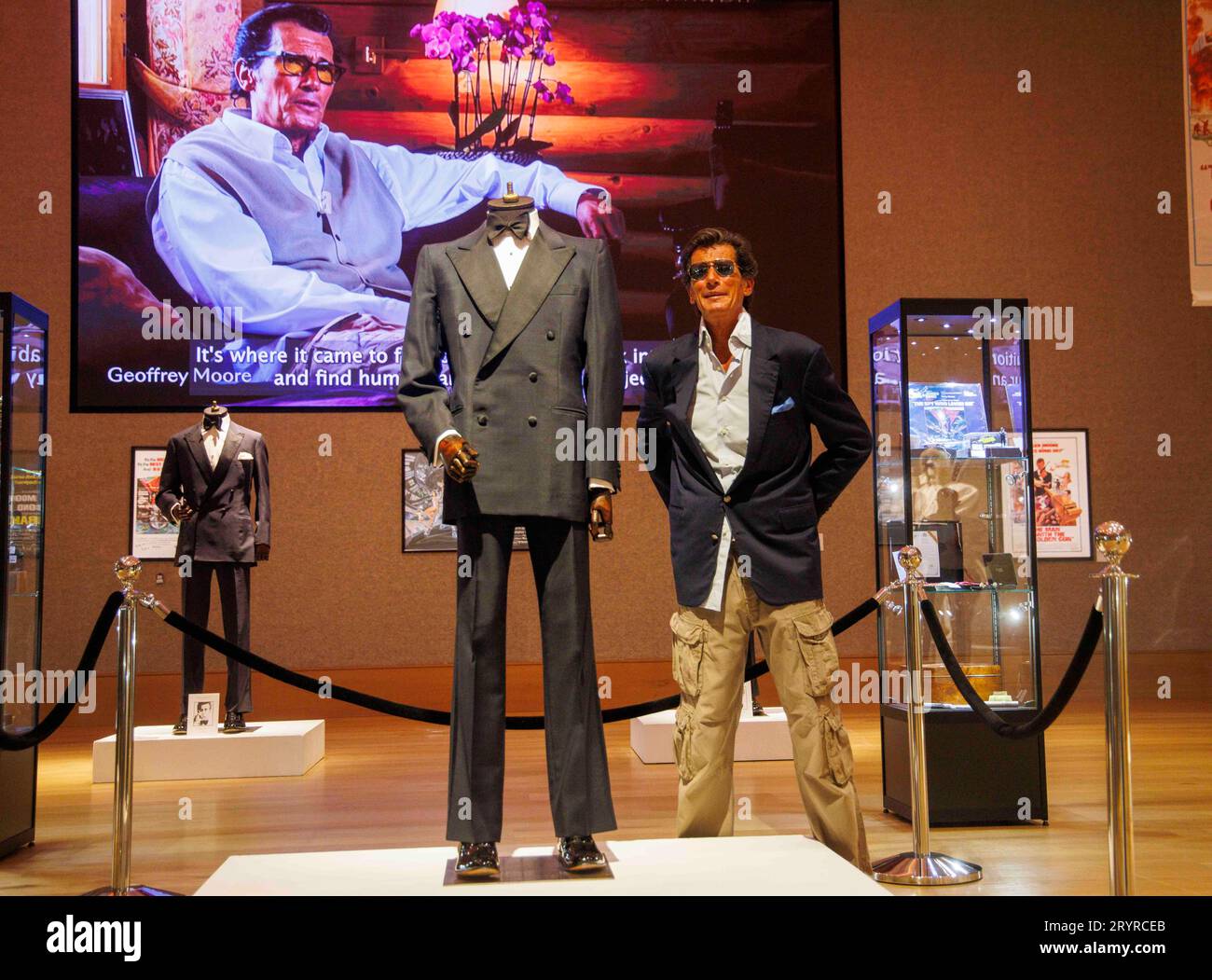 London, UK 2 Oct 2023 Roger MooreÕs son, Geoffrey, stands by a Double ...