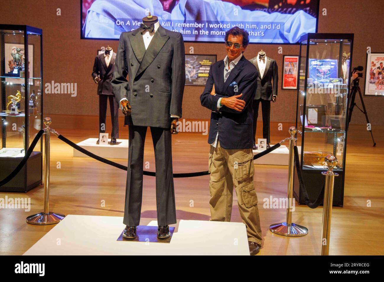 London, UK 2 Oct 2023 Roger MooreÕs son, Geoffrey, stands by a Double ...