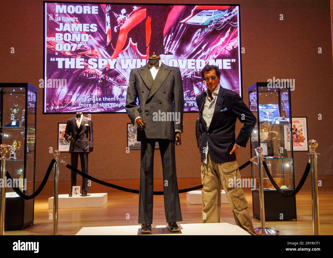 London, UK 2 Oct 2023 Roger MooreÕs son, Geoffrey, stands by a Double ...