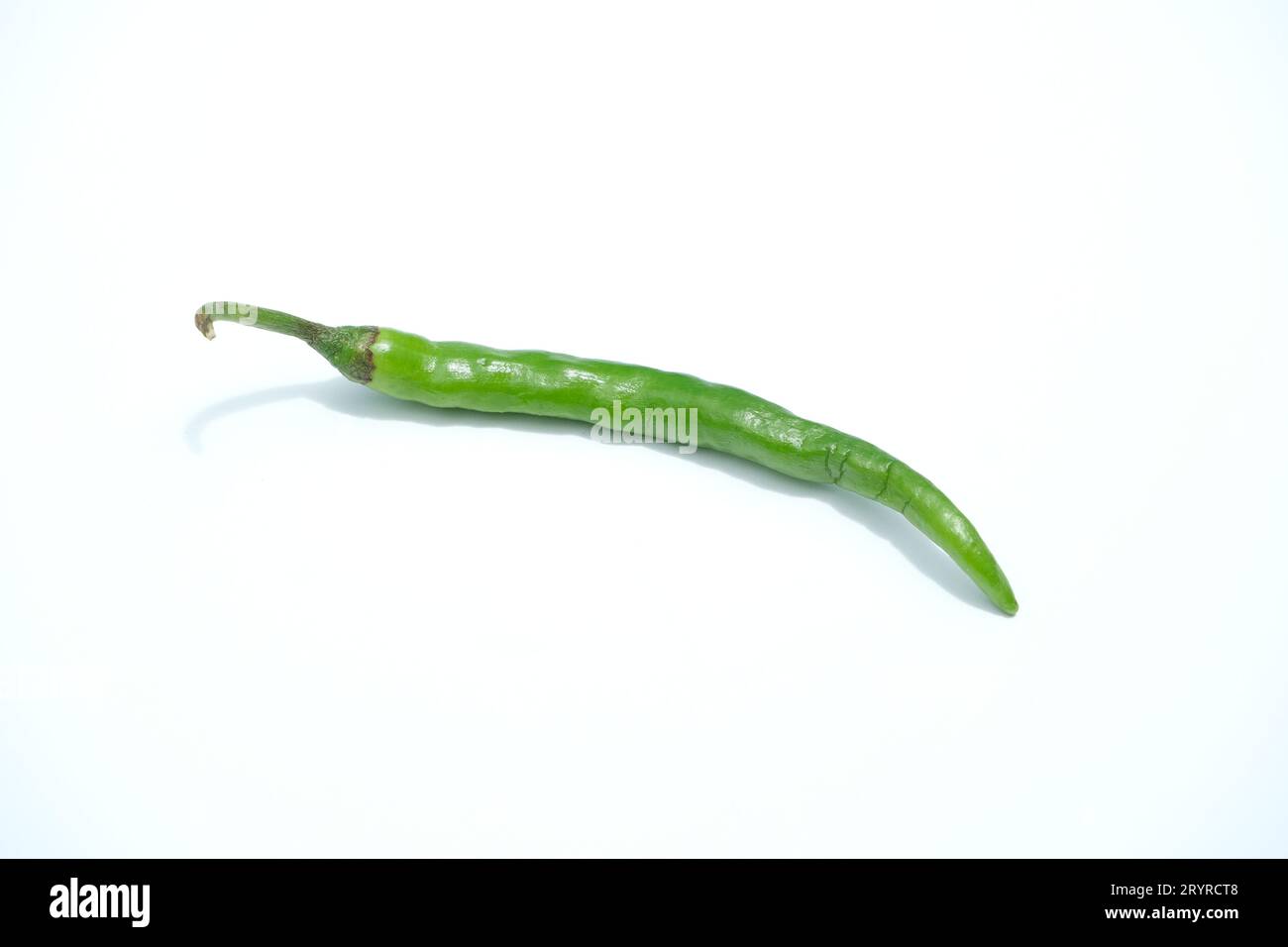Single green Chili is isolated in white background Stock Photo - Alamy